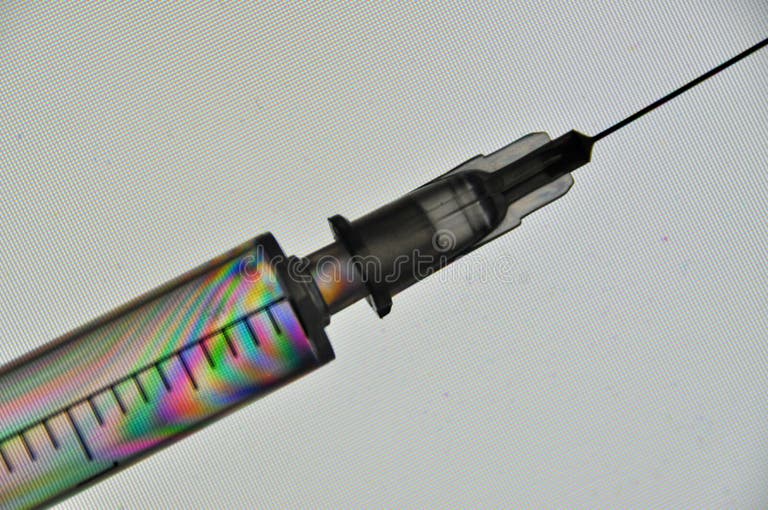 A Syringe with Colorful Rainbow Liquid Inside, an Injection with a ...