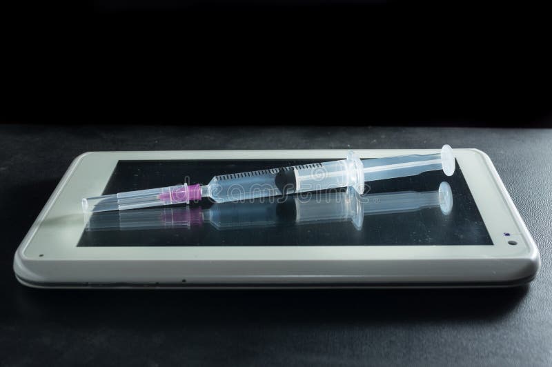 Syringe on Computer Tablet. Stock Image - Image of phone, computer ...