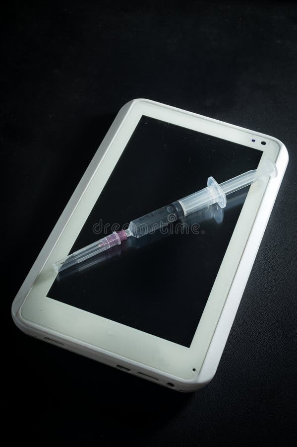 Syringe on Computer Tablet. Stock Image - Image of metal, health: 74143267