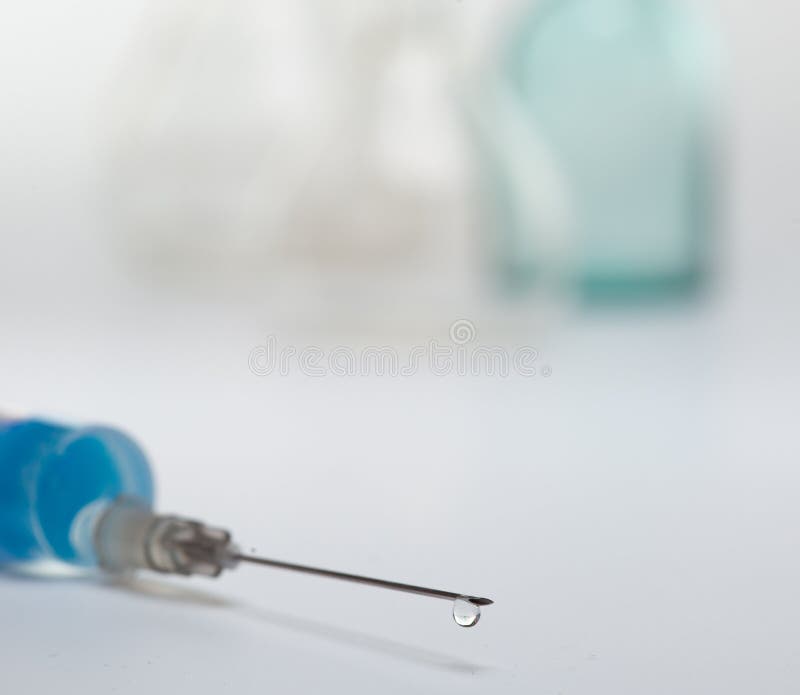 A Syringe with a Drop on the End of the Needle Stock Photo - Image of ...
