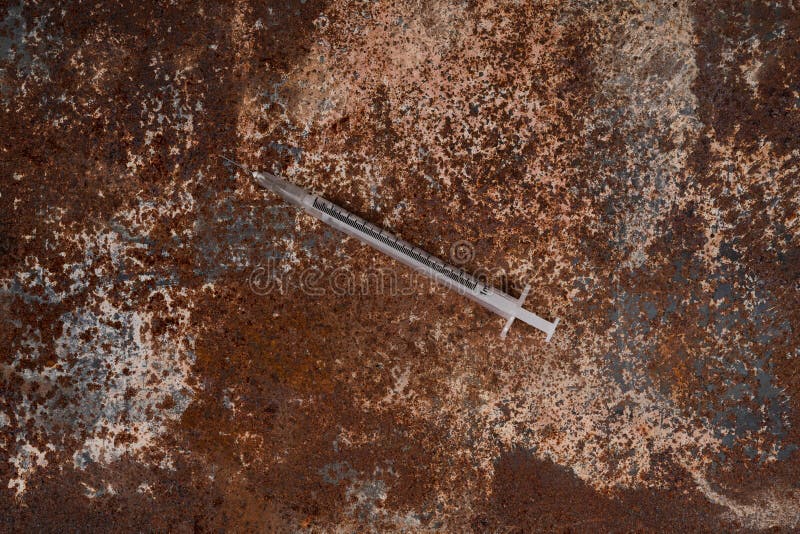 Syringe and Drugs on Dirty Rusty Background. Injection Syringe Stock ...