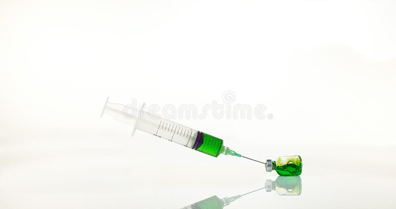 Syringe Falling Against White Background Stock Photo - Image of indoors ...