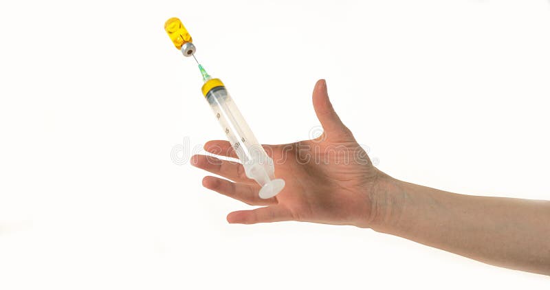 Syringe Falling into Hand Against White Background Stock Photo - Image ...