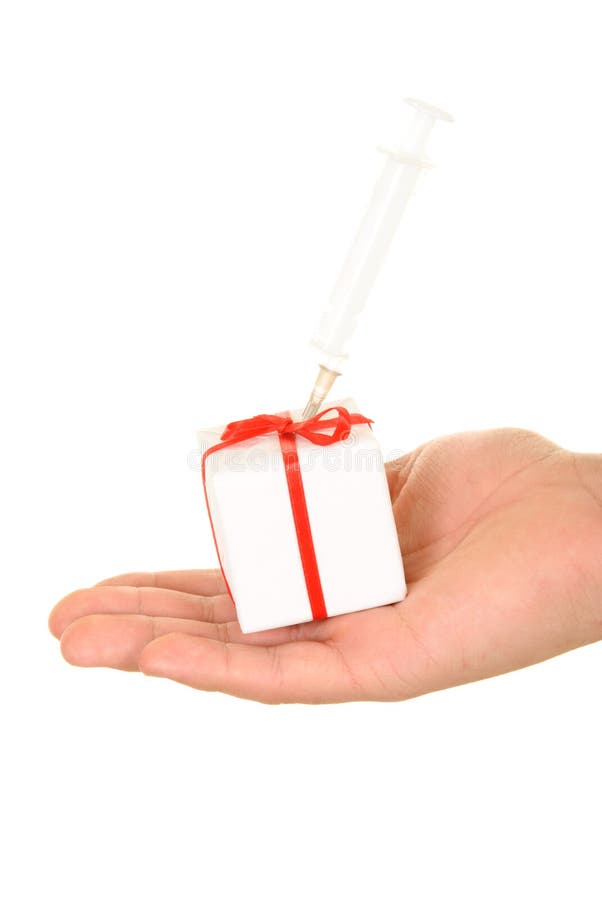 Syringe in gift on palm stock image. Image of ribbon - 12403643