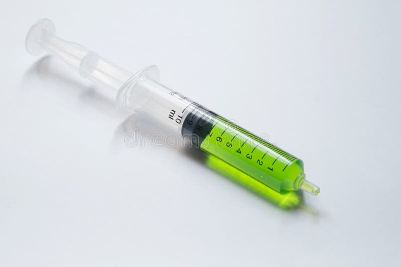 Syringe with green liquid stock photo. Image of syringe - 58956164
