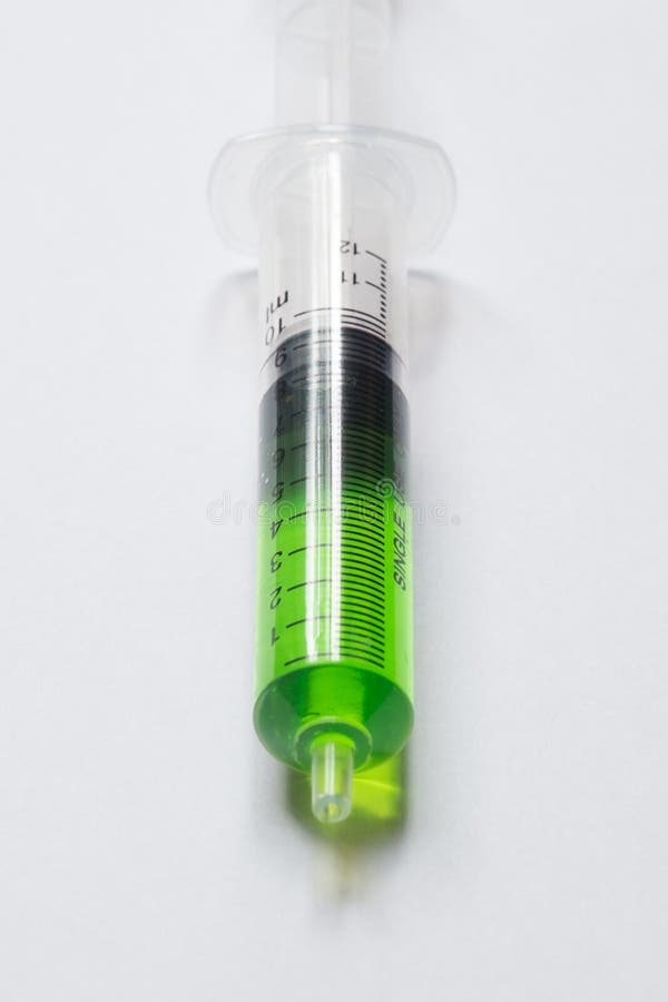 Syringe with green liquid stock photo. Image of laboratory - 58956256