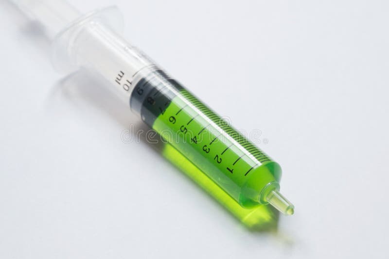 Syringe with green liquid stock photo. Image of laboratory - 58956256