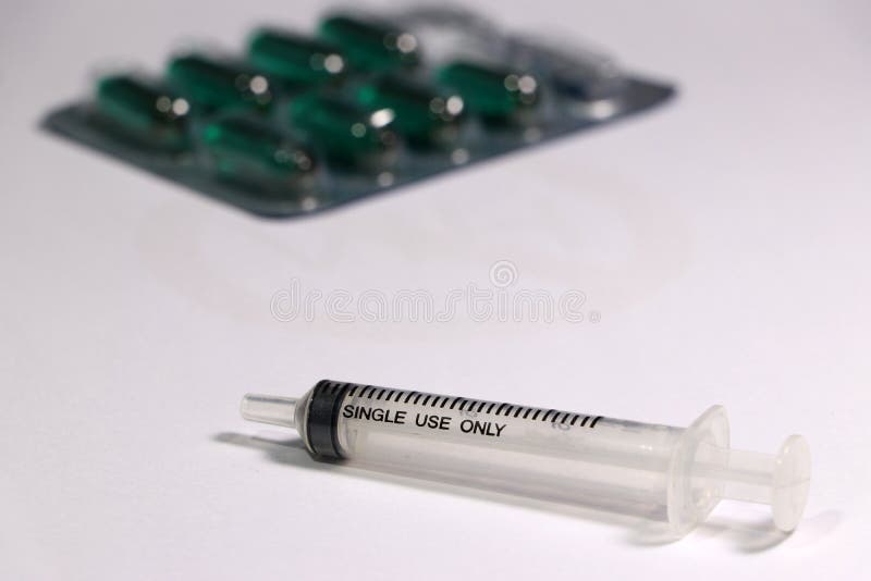 A Syringe on White Floor. it is Simple Reciprocating Pump Consisting of ...