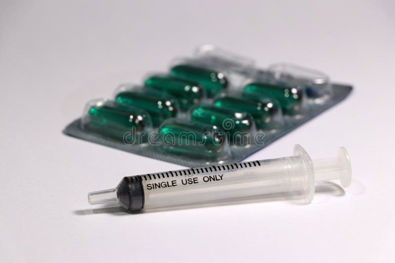 A Syringe on White Floor. it is Simple Reciprocating Pump Consisting of ...