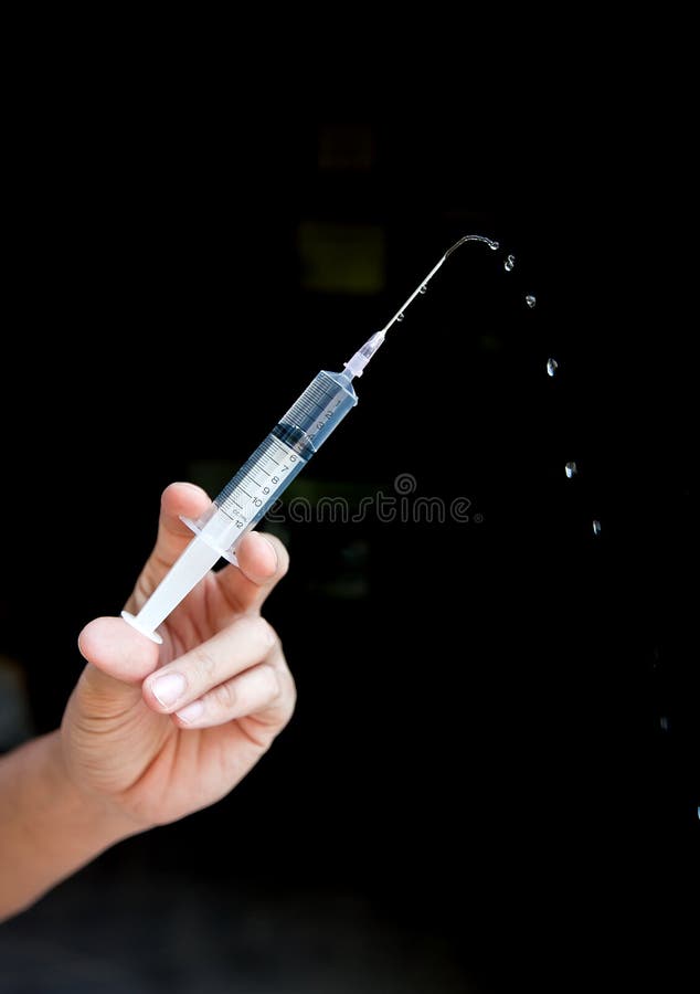 A syringe in a hand stock photo. Image of hospital, people - 23840646