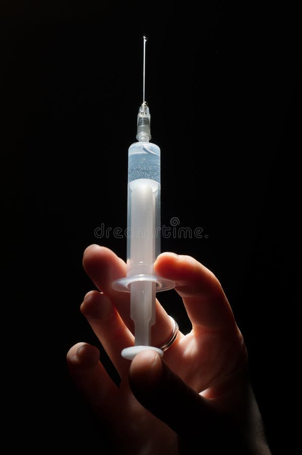 Syringe in hand stock image. Image of closeup, modern - 51742977