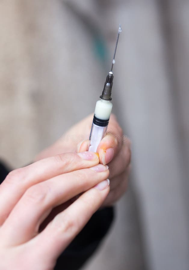 Syringe in hand stock photo. Image of health, plastic - 106530672