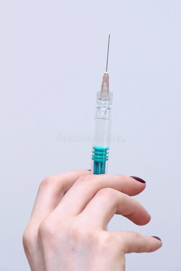 Syringe in hand stock photo. Image of hand, drug, health - 84989586