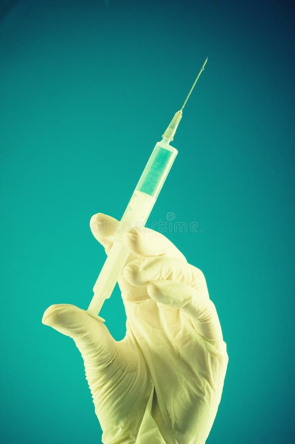 Syringe Hold by a Medic Hand Stock Image - Image of glove, hospital ...