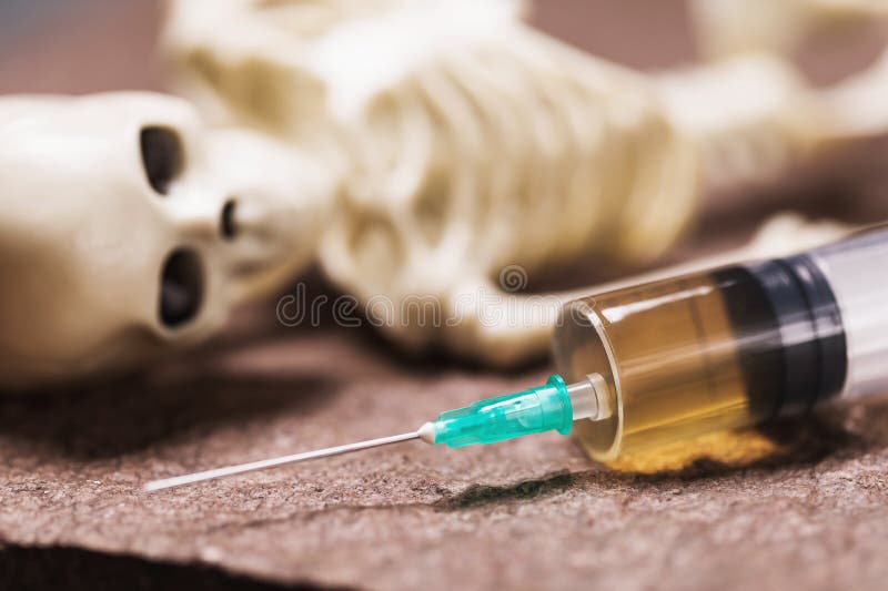 Syringe and Human Skeleton on a Stone. Lethal Injection Concept Stock ...