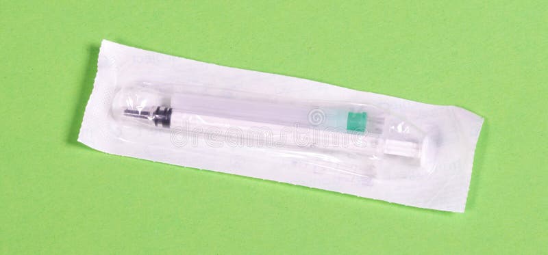 Syringe Injection or Medical Needle Isolated on Green Stock Photo ...