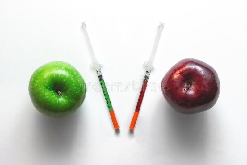 Syringe Injection with Red and Green Apple. Genetic Modified Foods ...