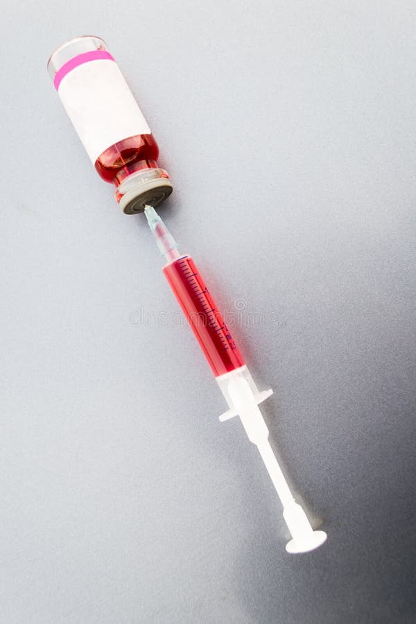 The Syringe is Inserted into the Can for Injection Stock Image - Image ...