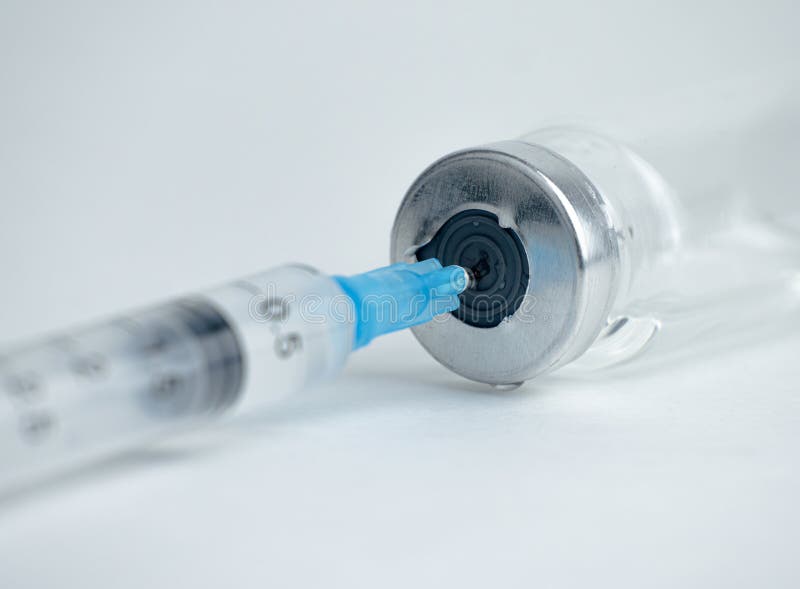 A Syringe is Inserted into a Vial Stock Photo - Image of dosage ...