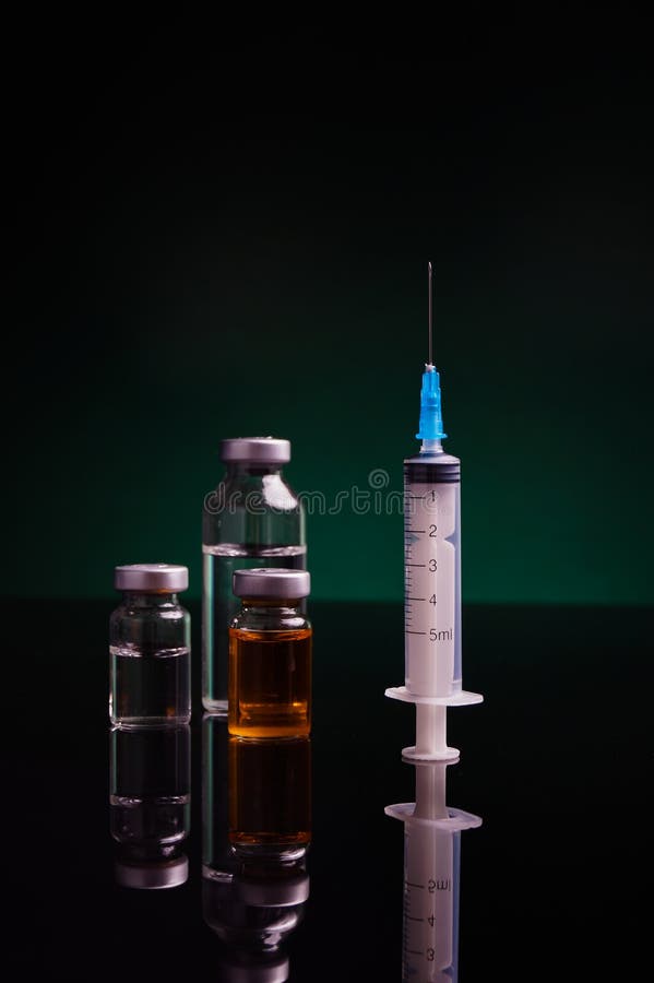 Syringe and medical vials stock image. Image of injections - 49114309