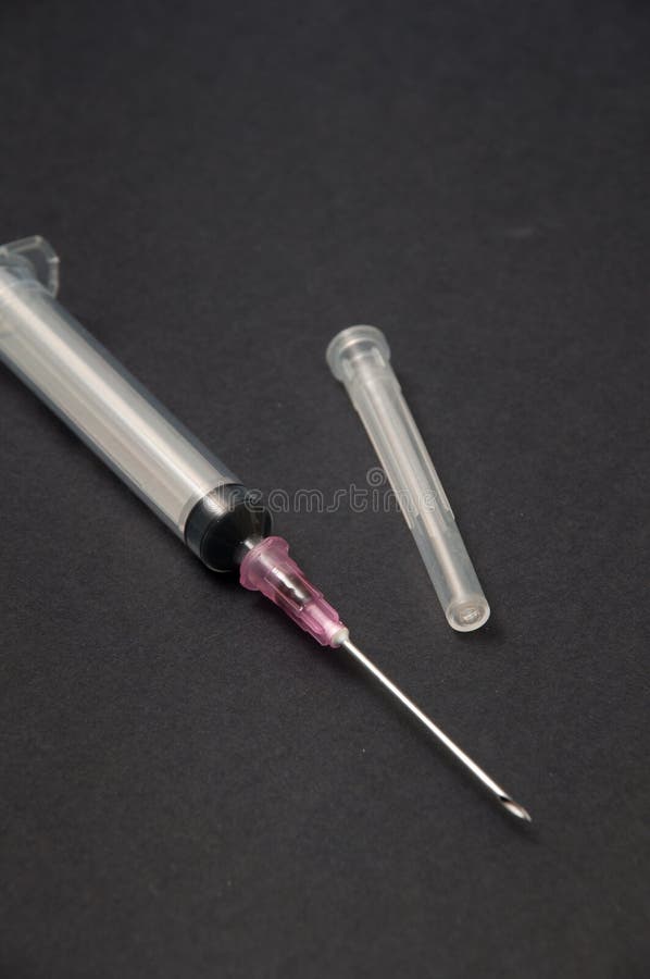 A Syringe with a Needle and Vaccine and Bandage Stock Photo - Image of ...