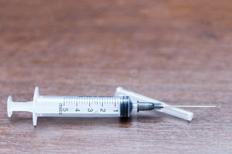 The Syringe with the Open Needle on the Table Stock Image - Image of ...
