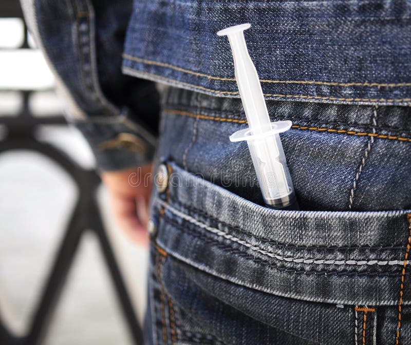 Syringe in the pocket stock image. Image of blue, popular - 64122103