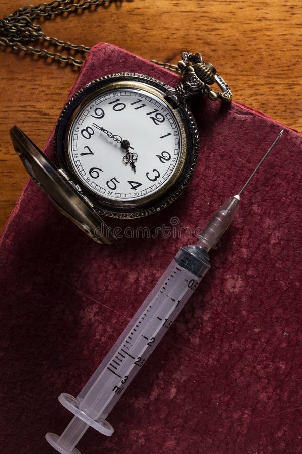 Syringe and Pocket Watch with Book. Stock Image - Image of diagnose ...