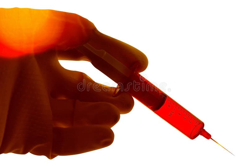 Syringe with Red Liquid Held in a Gloved Hand. Close Up Backlit ...