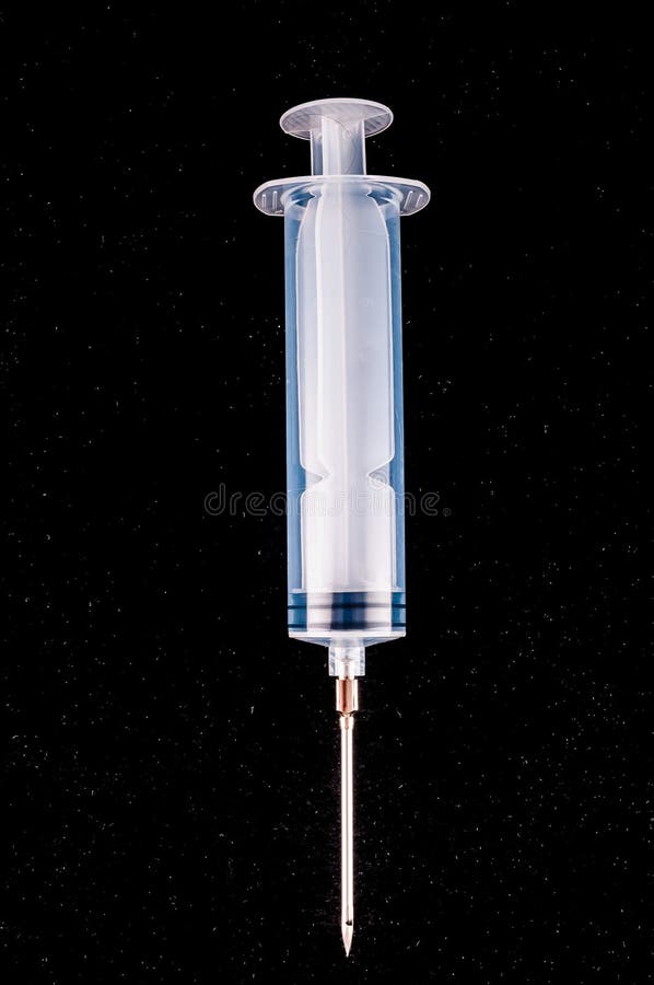 A Syringe is Shown in a Black Background Stock Image - Image of ...