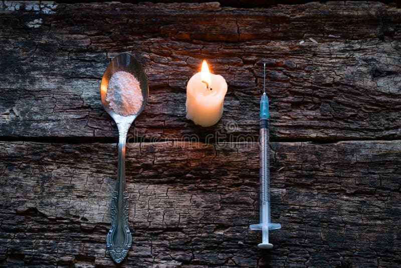 Syringe and Spoon with Heroin Next To a Candle Stock Photo - Image of ...