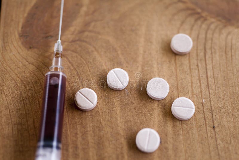 Syringe on a table stock photo. Image of hygiene, heroin - 62242470