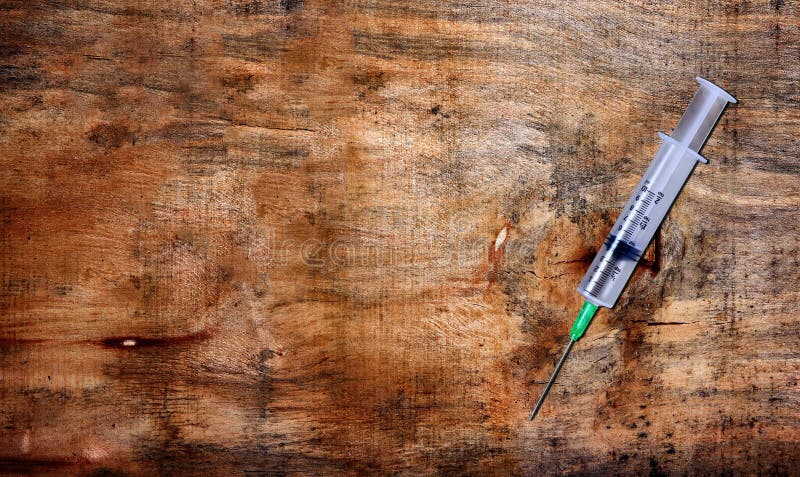 Syringe on table stock image. Image of wooden, legal - 60052803