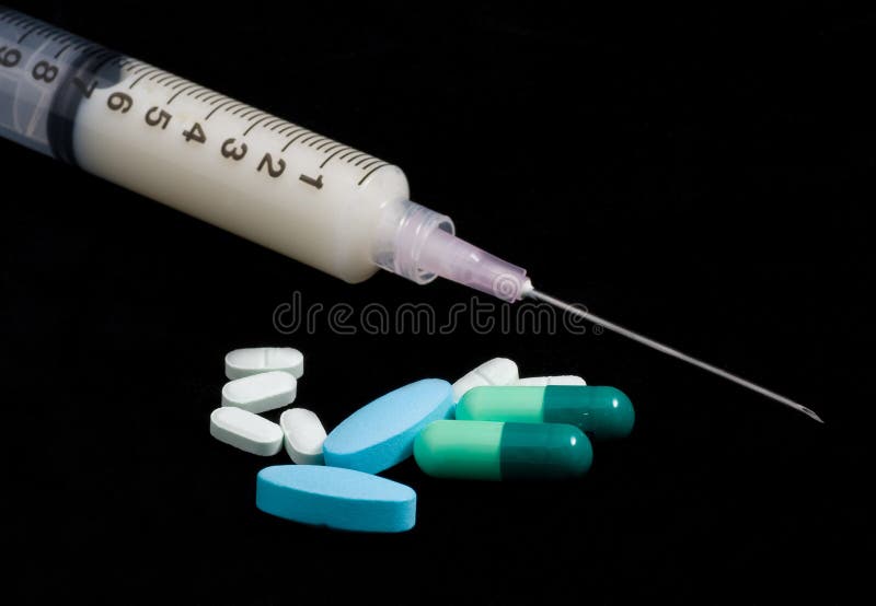 Syringe and tablets 1 stock photo. Image of addiction - 6817796