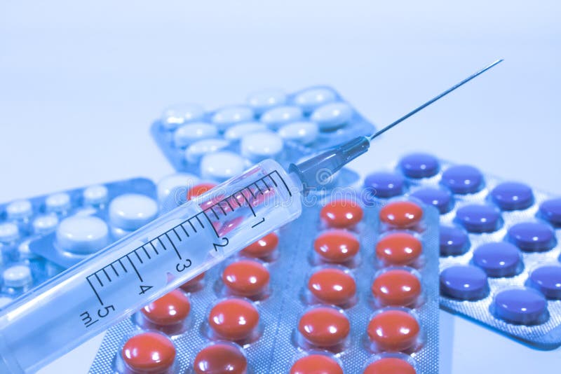 Syringe and tablets. stock image. Image of treatment - 11695067