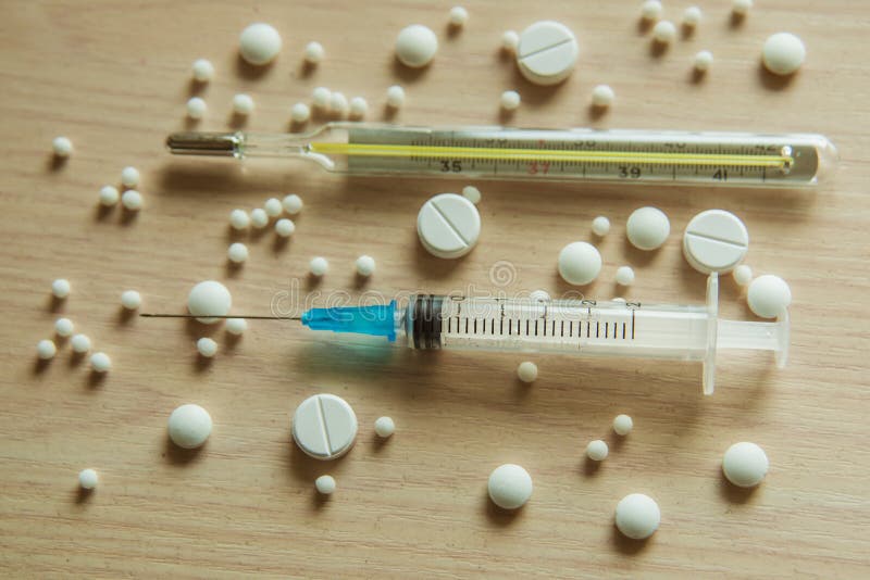 Syringe and Tablets are Located on the Wooden Surface Stock Photo ...