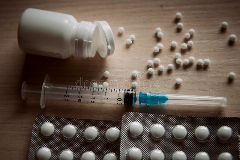 Syringe and Tablets are Located on the Wooden Surface Stock Image ...