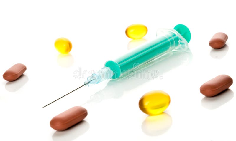 Syringe with tablets stock photo. Image of yellow, drugs - 40044612