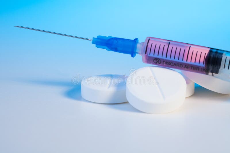 Syringe and tablets stock photo. Image of bright, illness - 31795952