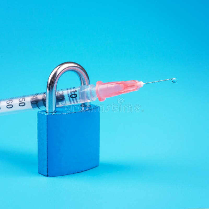 A Syringe with a Vaccine, Lock Symbol of Safety and Security ...