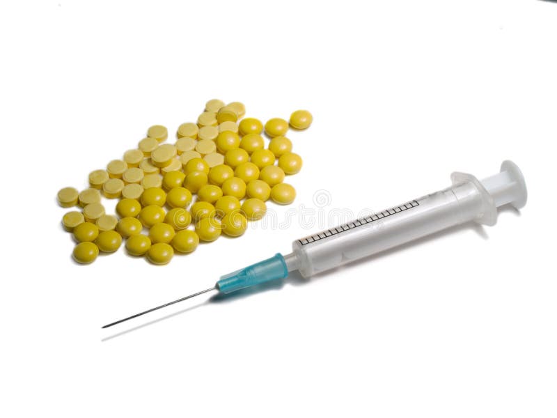 Syringe and yellow tablets stock image. Image of injecting - 2099077