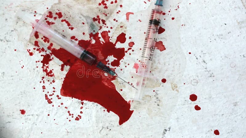 Syringes Falling on Bloody Surface Stock Footage - Video of pool ...