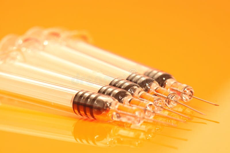 Syringes with Orange Caps Isolated. Injections Stock Image - Image of ...
