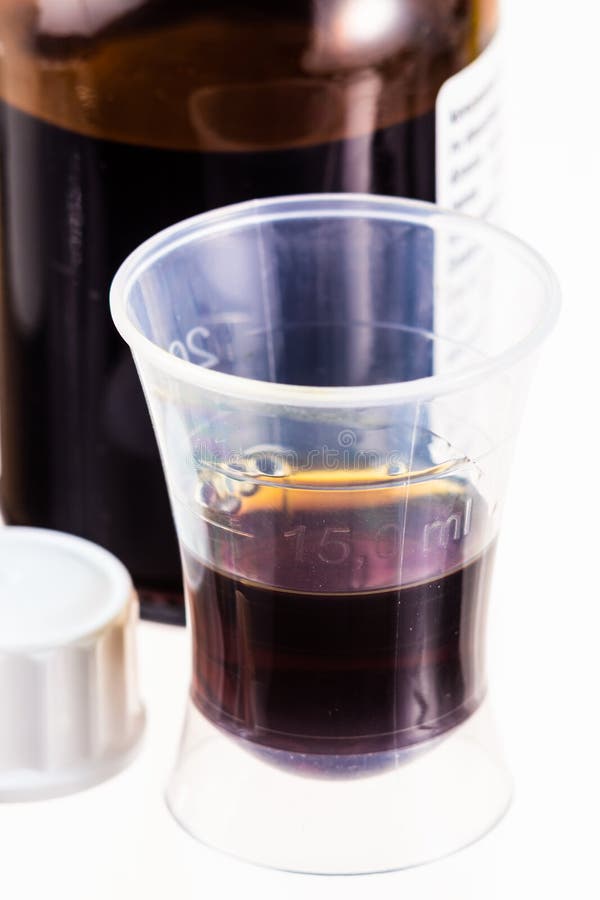 Medicine Syrup Plastic Measuring Cup And Medicine Stock Photo - Image ...