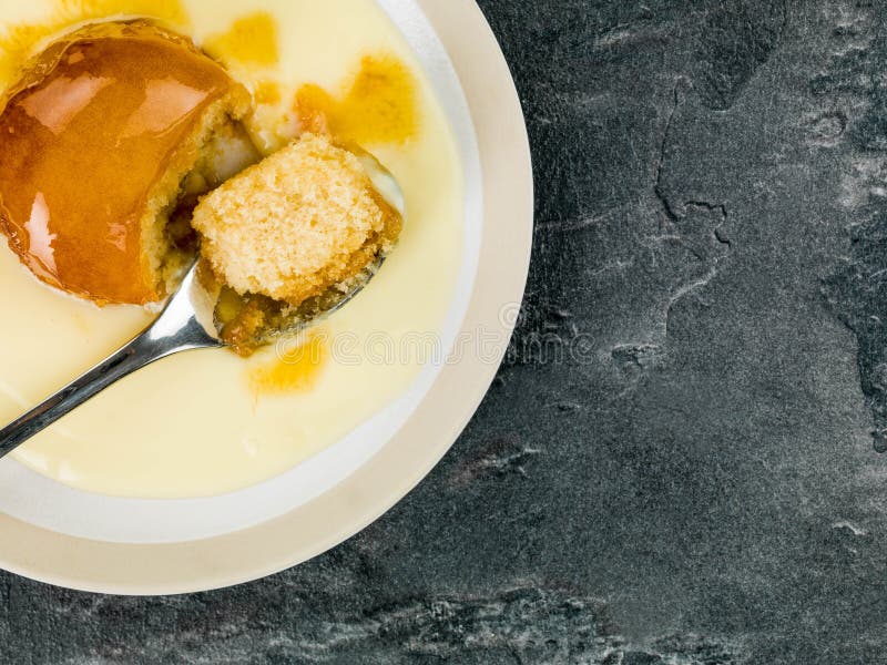 Treacle Pudding and Custard Stock Photo - Image of english, sauce: 46589244