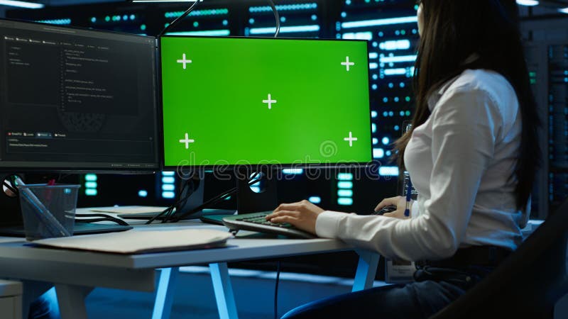 System Administrator Overseeing Data Center Using Green Screen Computer ...