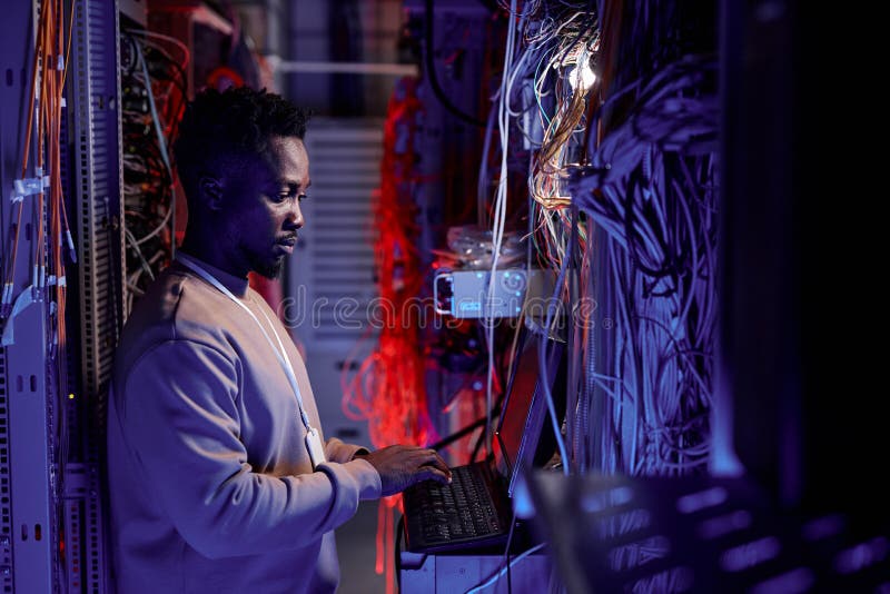 System Administrator Using Computer in Server Room Neon Light Stock ... System Administrator Using Computer in Server Room Neon Light Stock ...