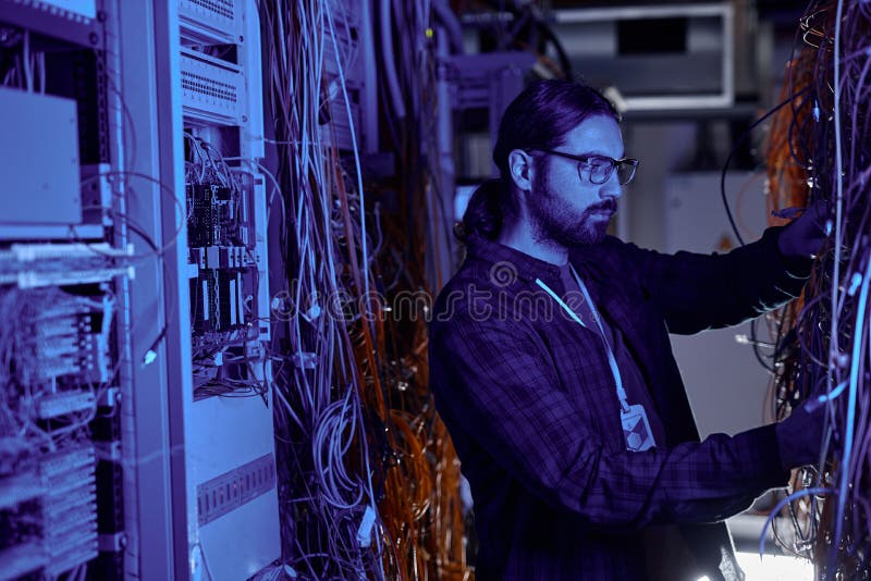 System Administrator Working with Server in Neon Light Stock Image ...