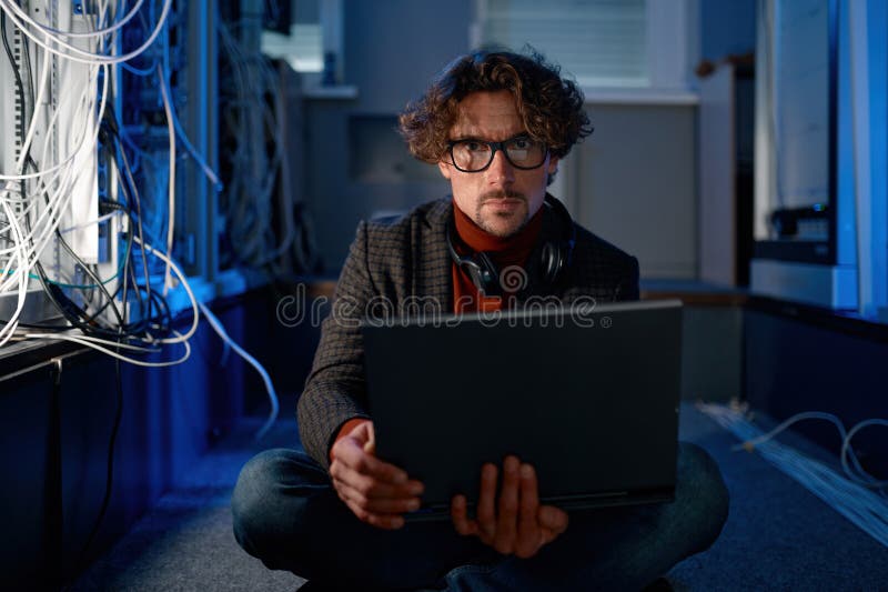 A System Administrator Working in Server Room Using Laptop Stock Image ... A System Administrator Working in Server Room Using Laptop Stock Image ...