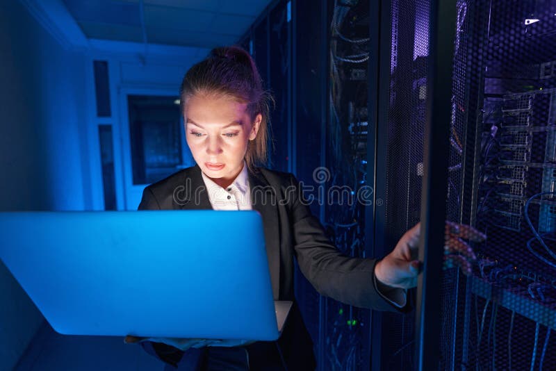 System Technician Using Laptop To Analyze Server Stock Image - Image of ...